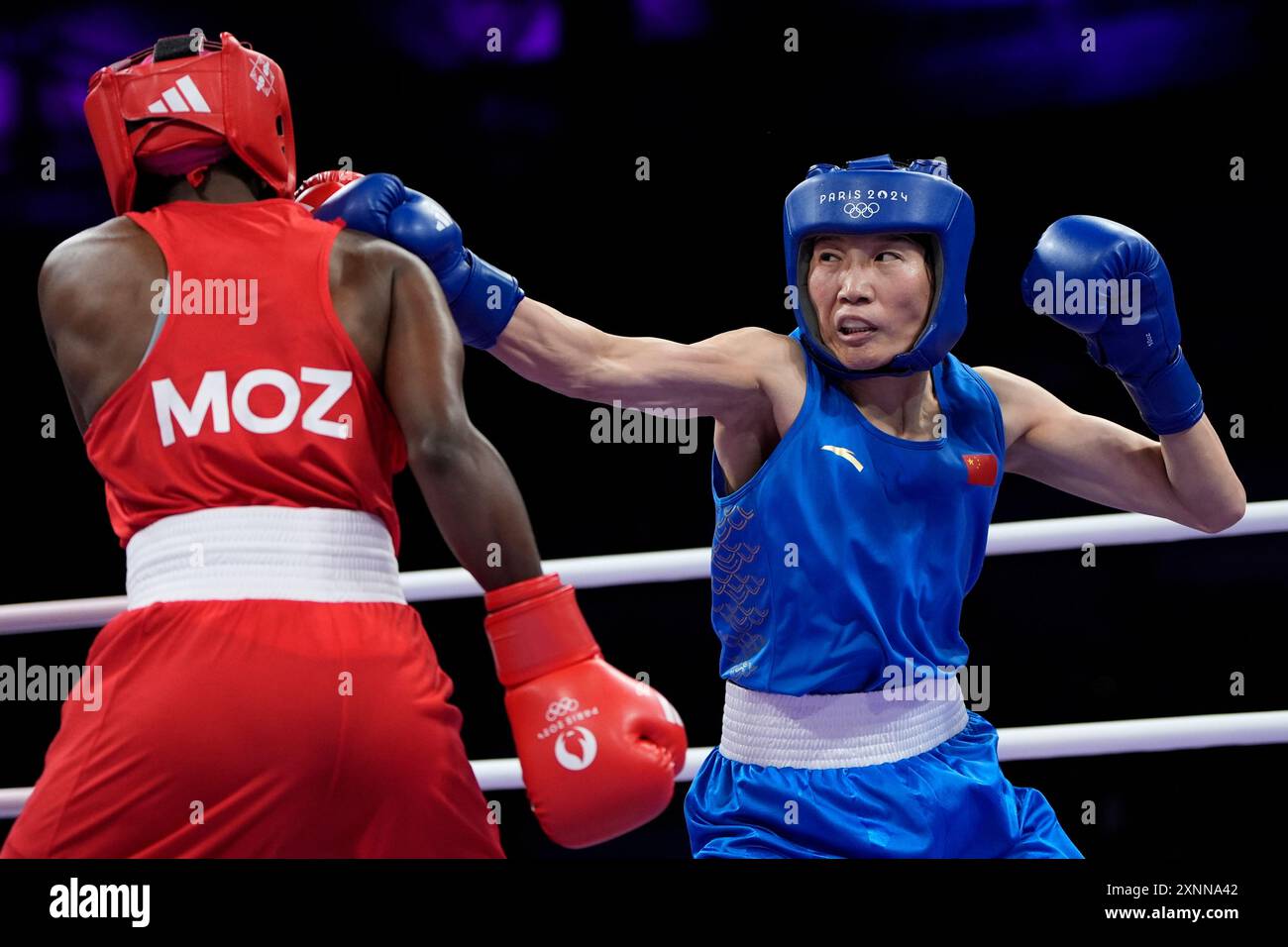 Mozambique's Alcinda Dos Santos, left, fights China's Yang Liu in their ...