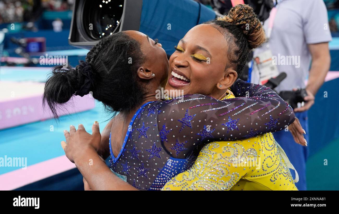 Simone Biles, left, of the United States, hugs Rebeca Andrade, of ...