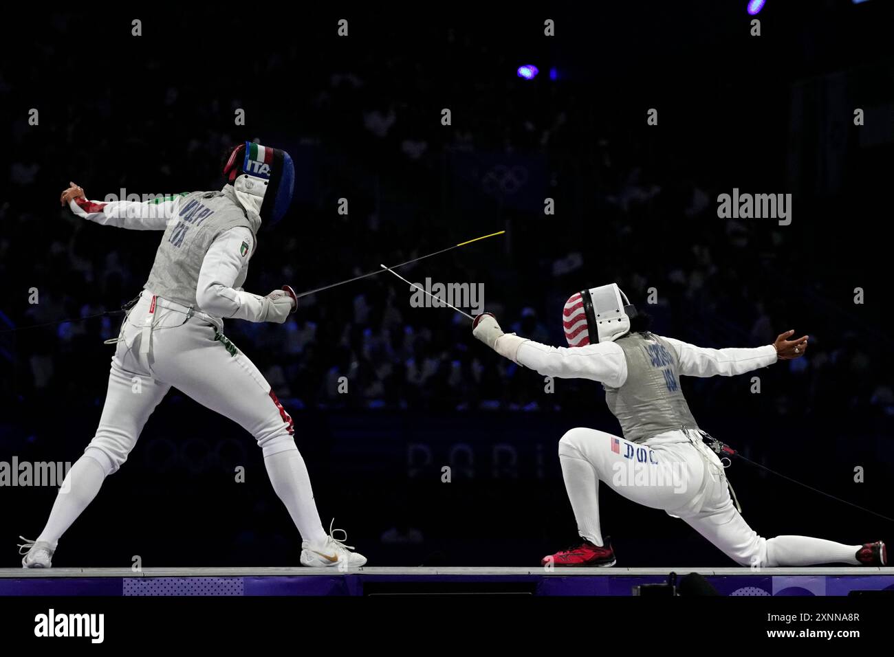 Italy's Alice Volpi, left, competes with United States' Lauren Scruggs ...