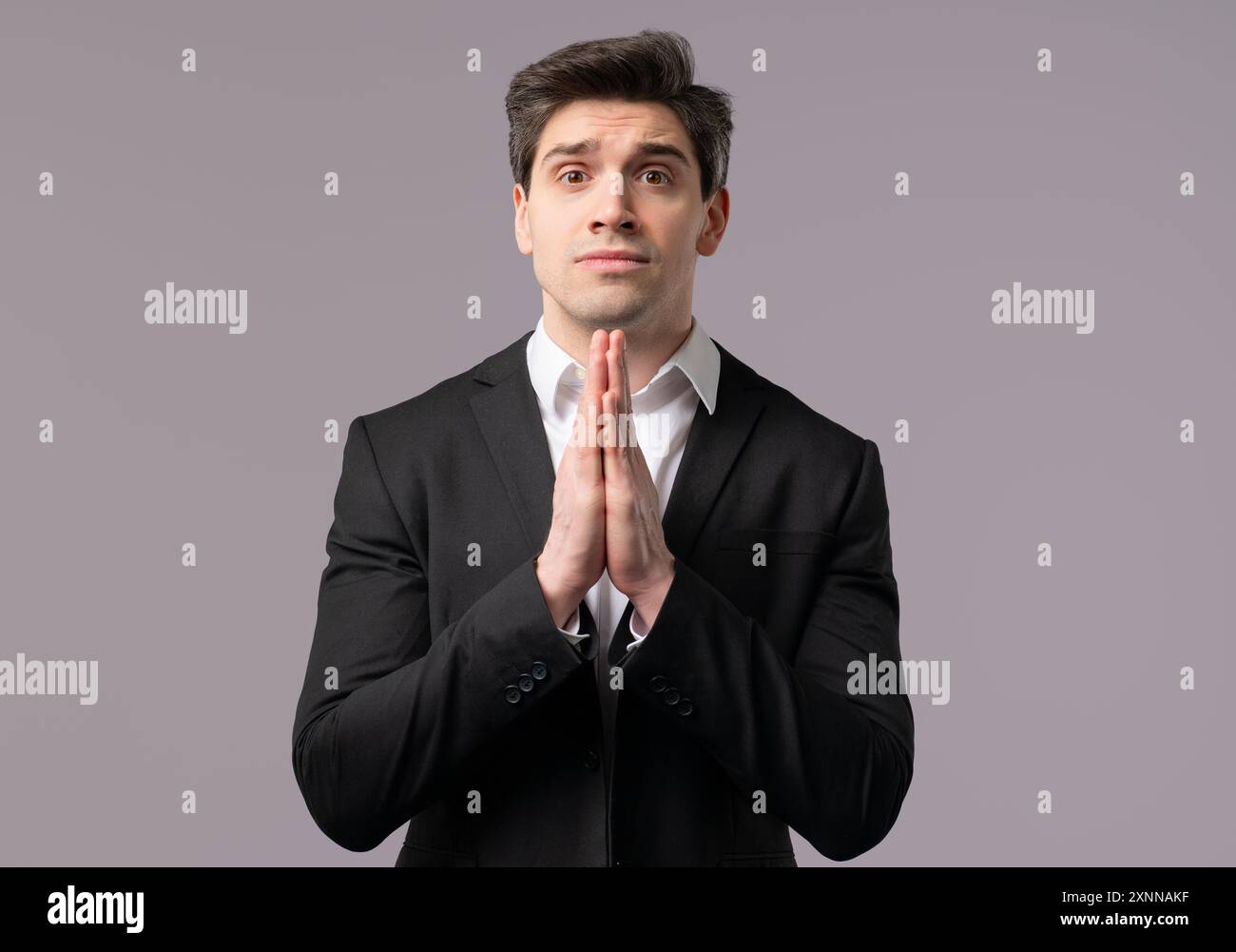 Corporate businessman praying hands hi-res stock photography and images ...