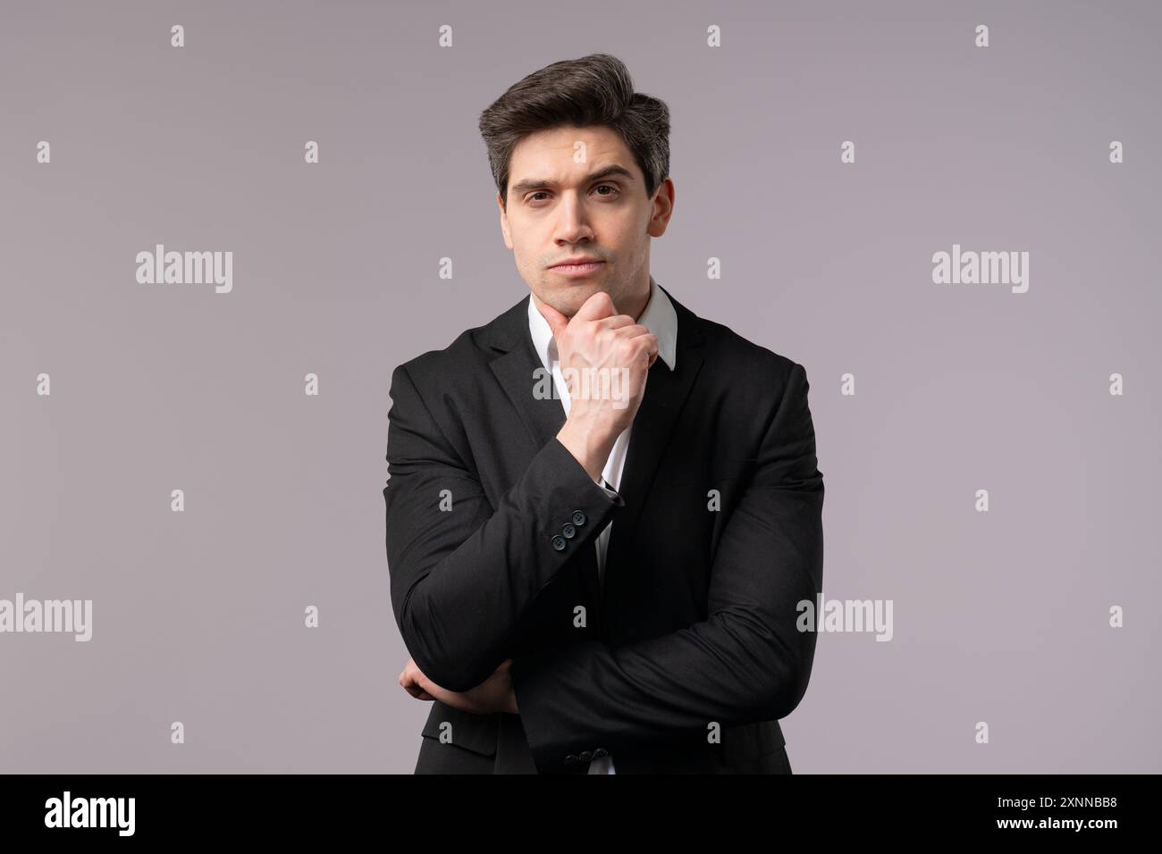 Thinking man looking up and around on grey background. Worried ...
