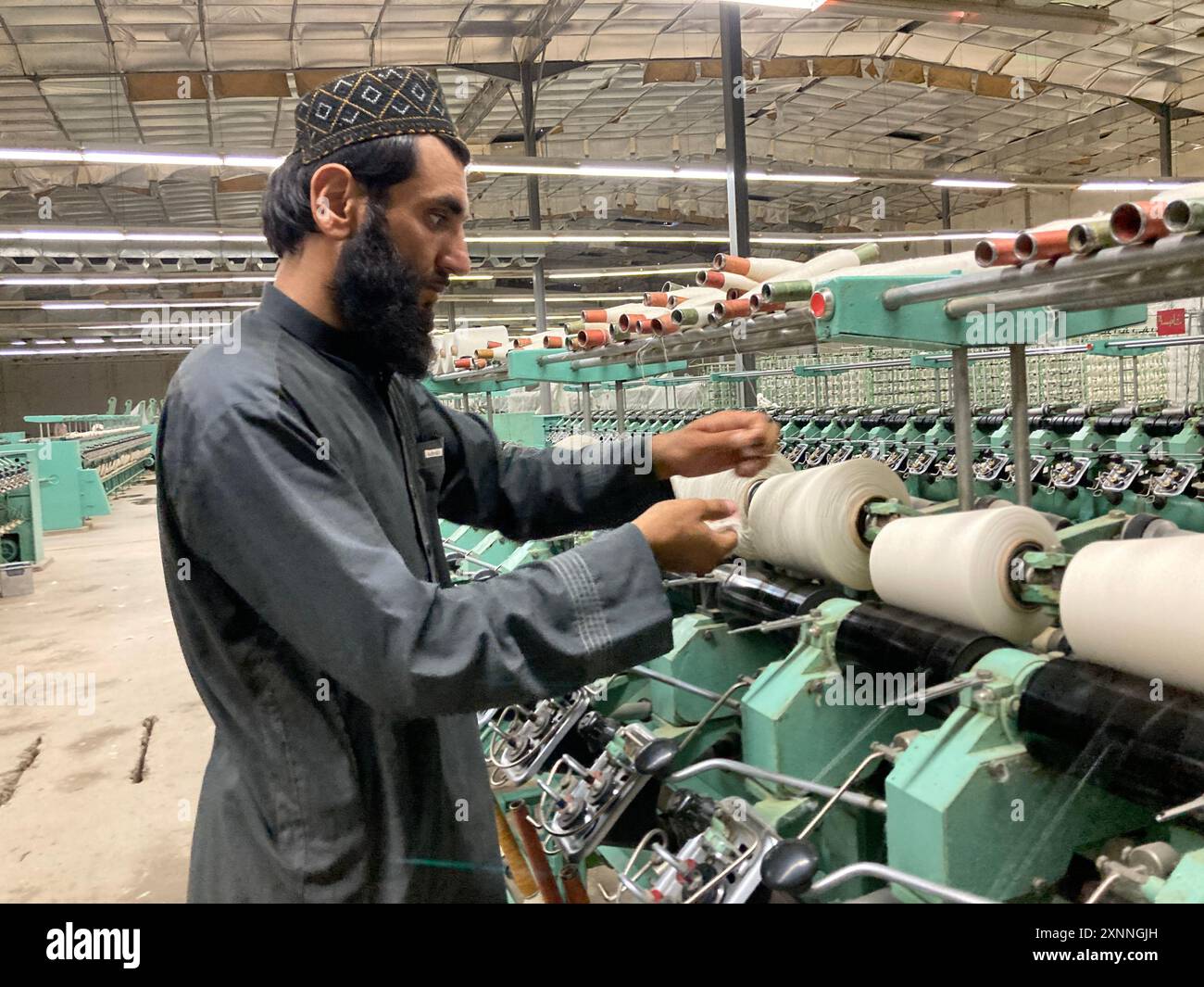 Kandahar, Afghanistan. 31st July, 2024. A man works at a textile factory in Kandahar Province ...