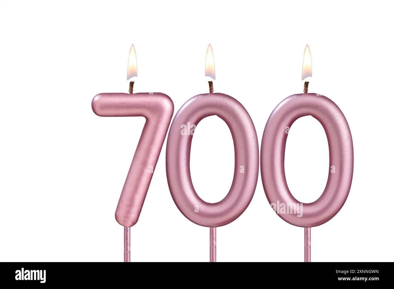 Candle number 700 - Lit birthday candle on white background Stock Photo ...