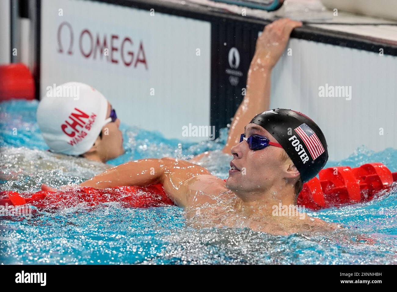 Carson Foster, of the United States, checks his time after competing in ...