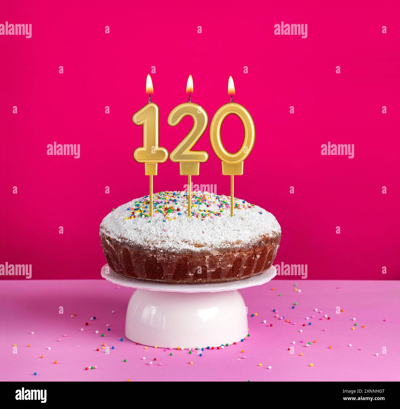 Lighted birthday candle number 120 - Birthday card on pink background ...