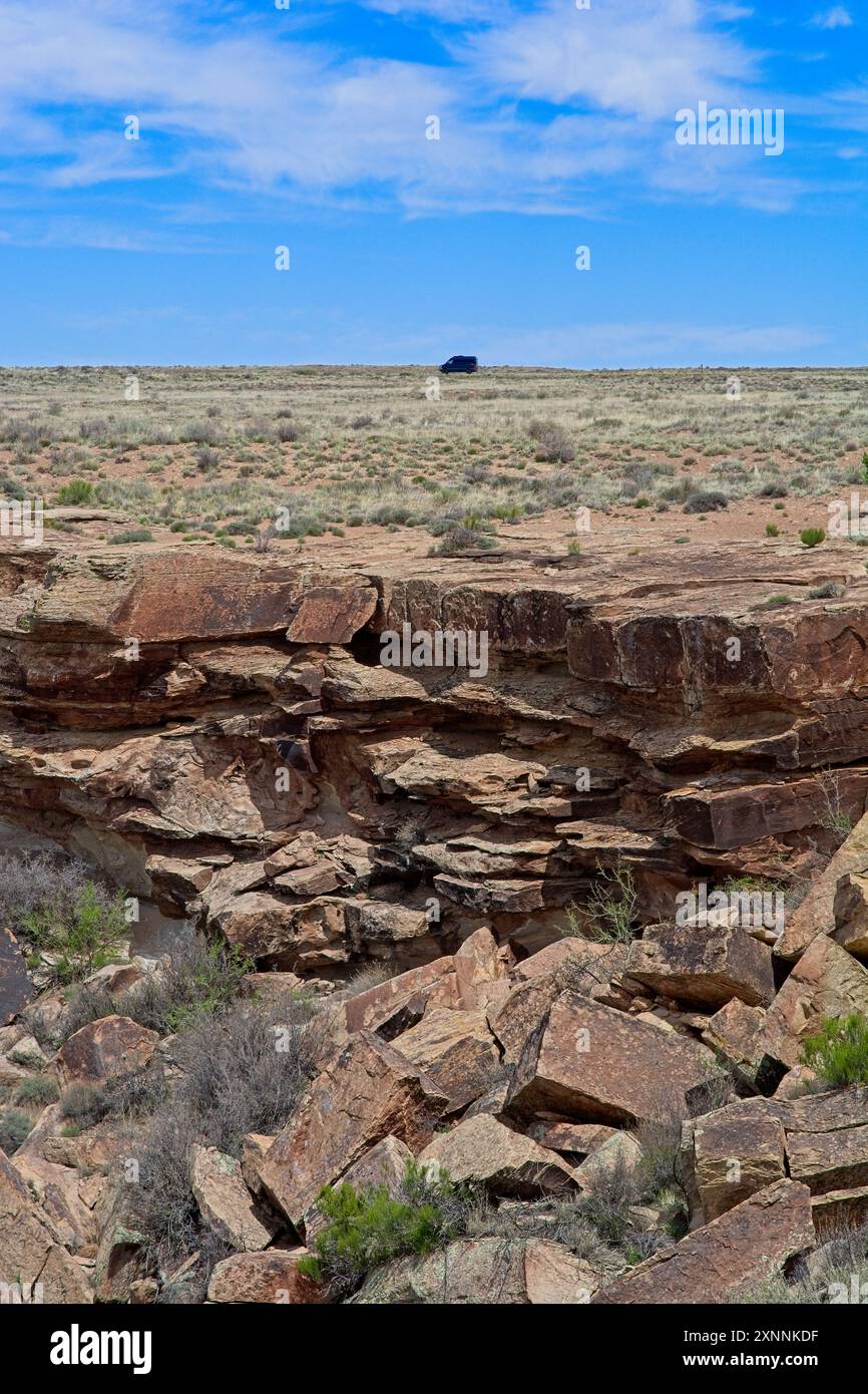 Eroding limestone cap rock of Painted Desert prairie with distant ...