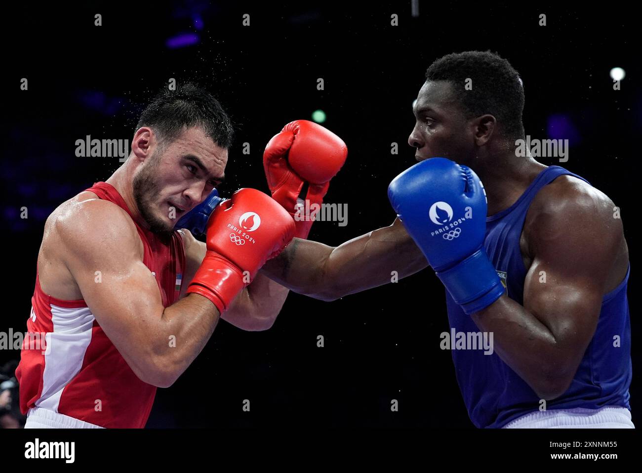 Uzbekistan's Lazizbek Mullojonov, left, fights Brazil's Keno Machado in ...
