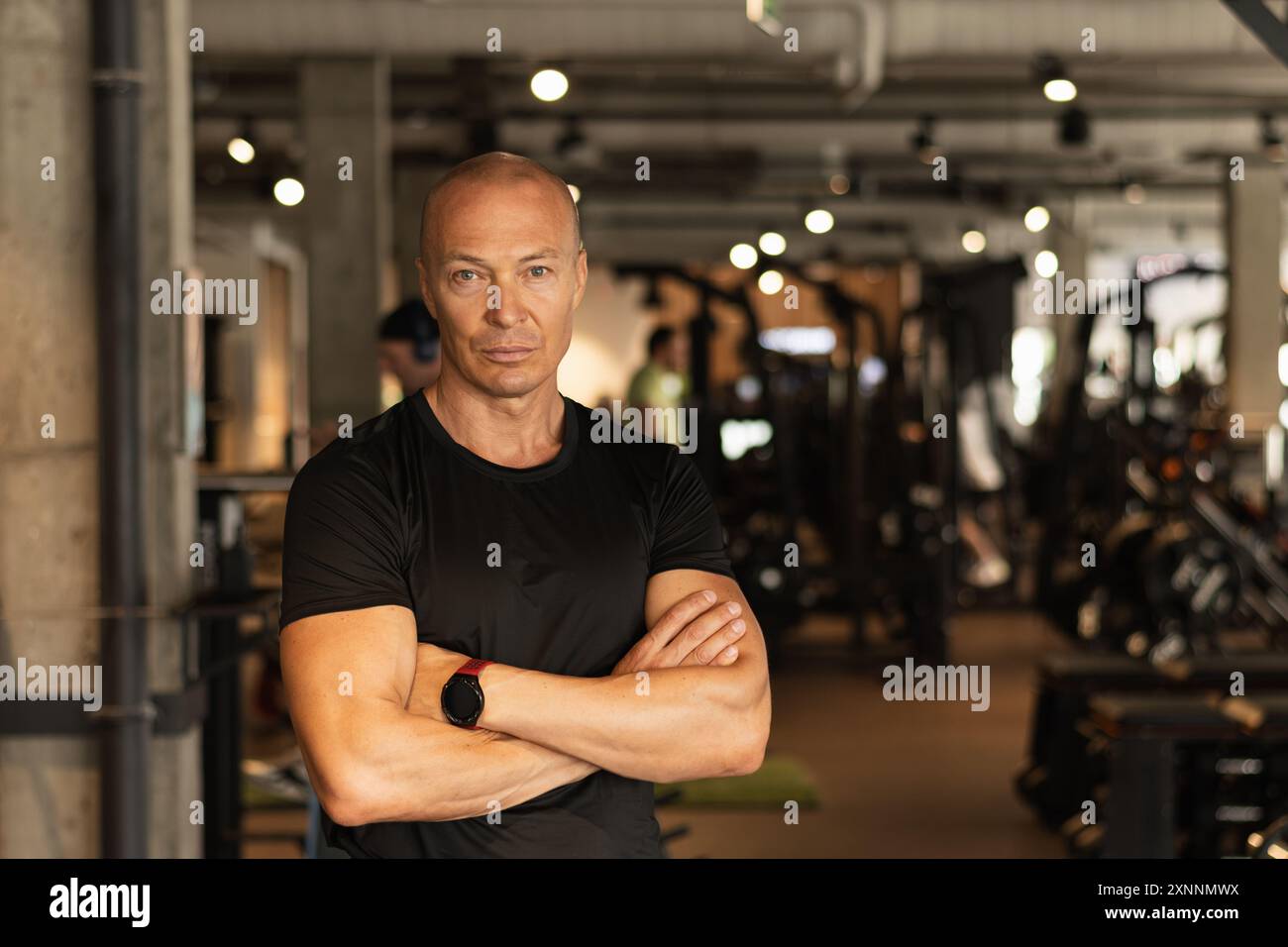 Bald handsome sportsman wearing black hi-res stock photography and ...