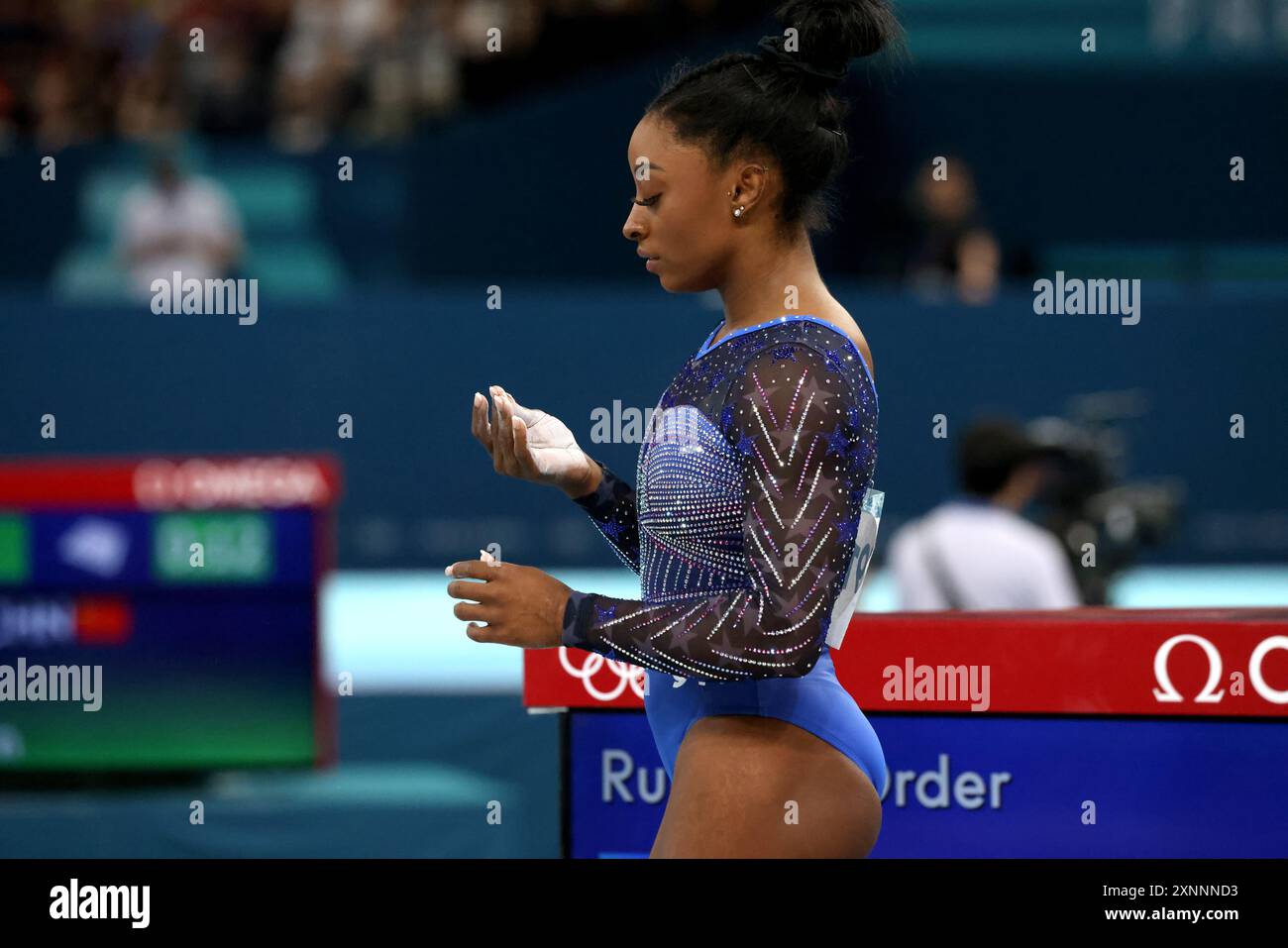 Paris, France. August 1st 2024. USA's Simone Biles checks her hands ...