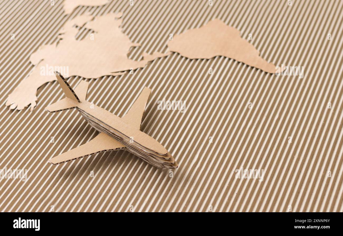 Airplane and world map made of cardboard Stock Photo - Alamy