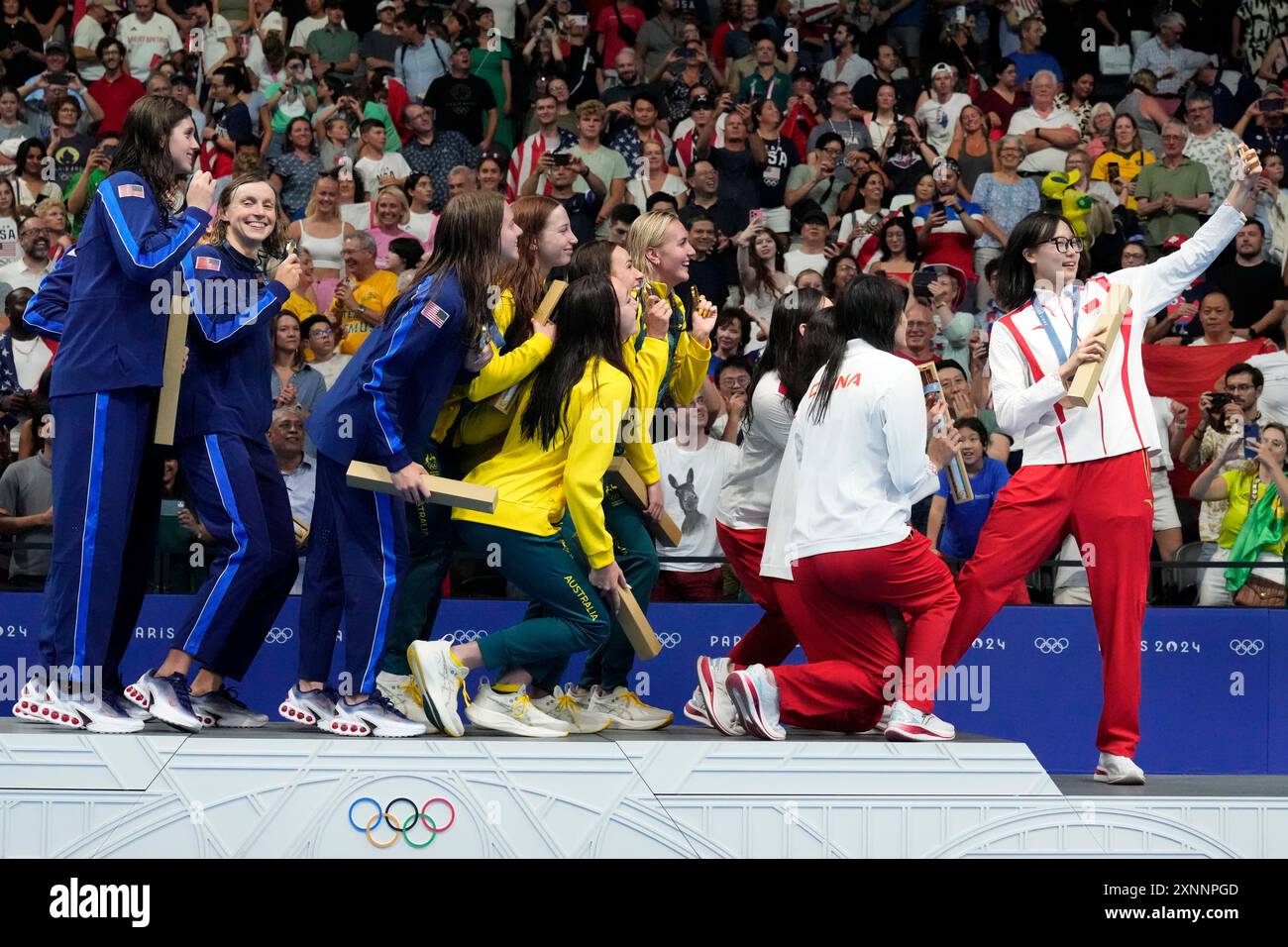 Gold medalists Team Australia, center, silver medalists Team USA, left, and bronze medalists ...