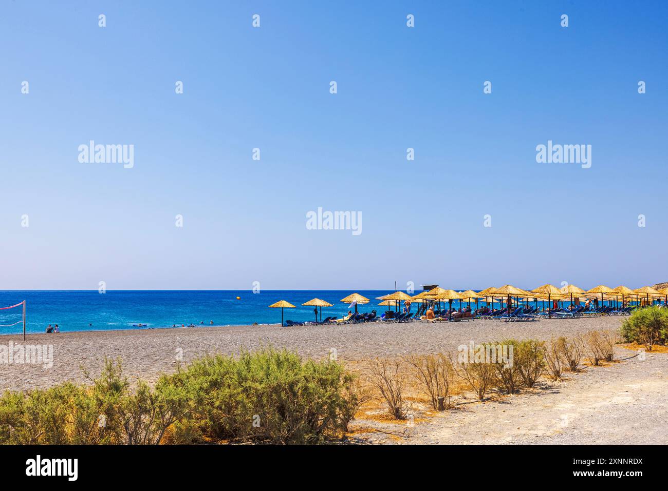 Beautiful view of the Mediterranean Sea on Crete with people relaxing ...