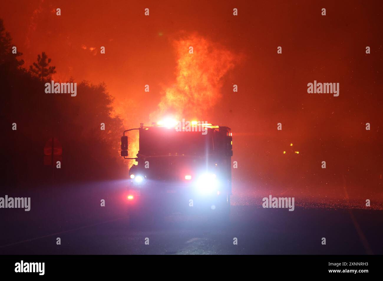Chico, California, USA. August 1, 2024. Flames behind fire engine ...