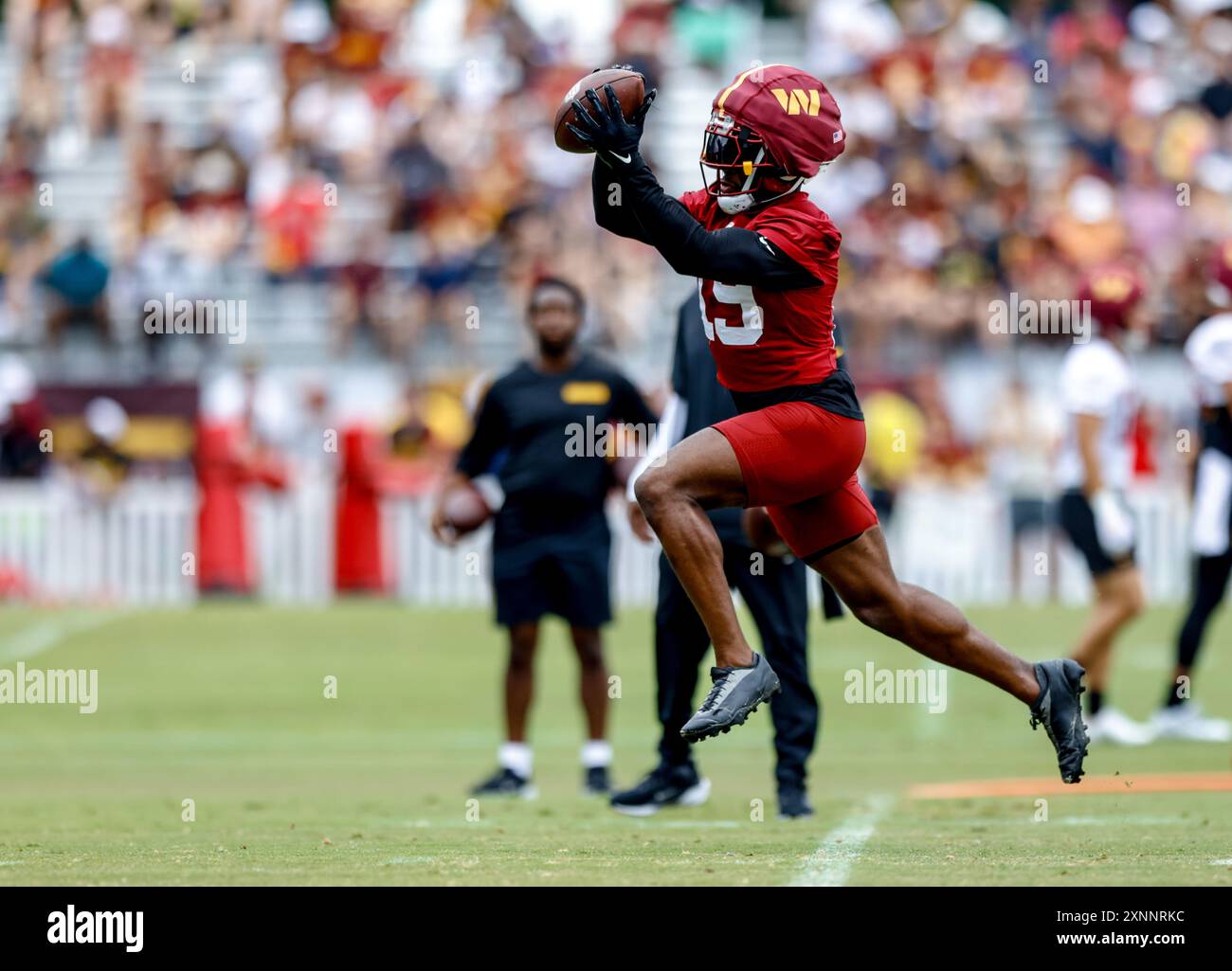 Washington Commanders cornerback Noah Igbinoghene (19) makes a catch ...