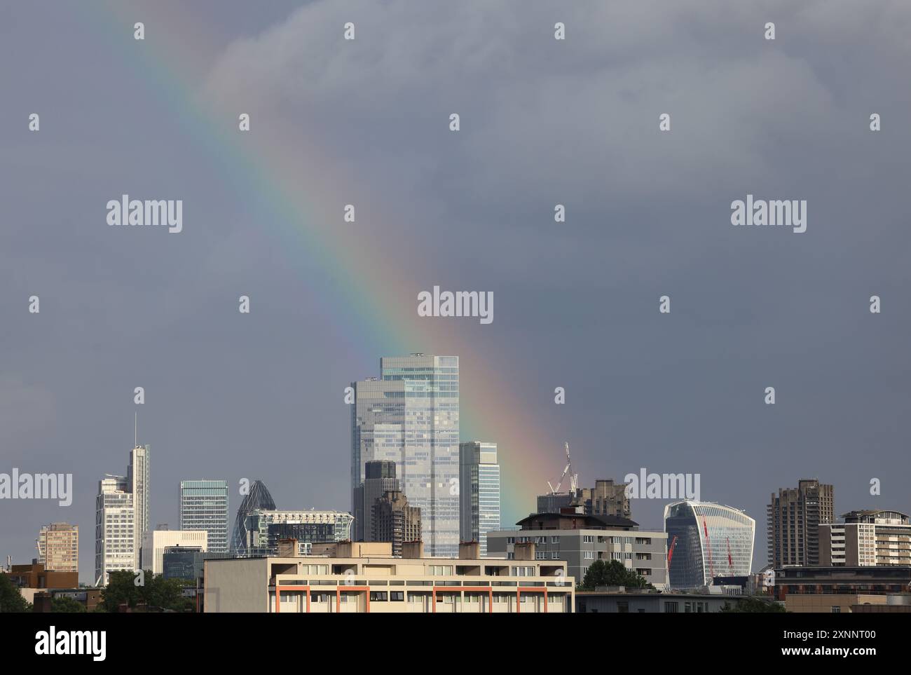Rainbow over the skyscrapers of the City of London, in summer 2024, UK ...