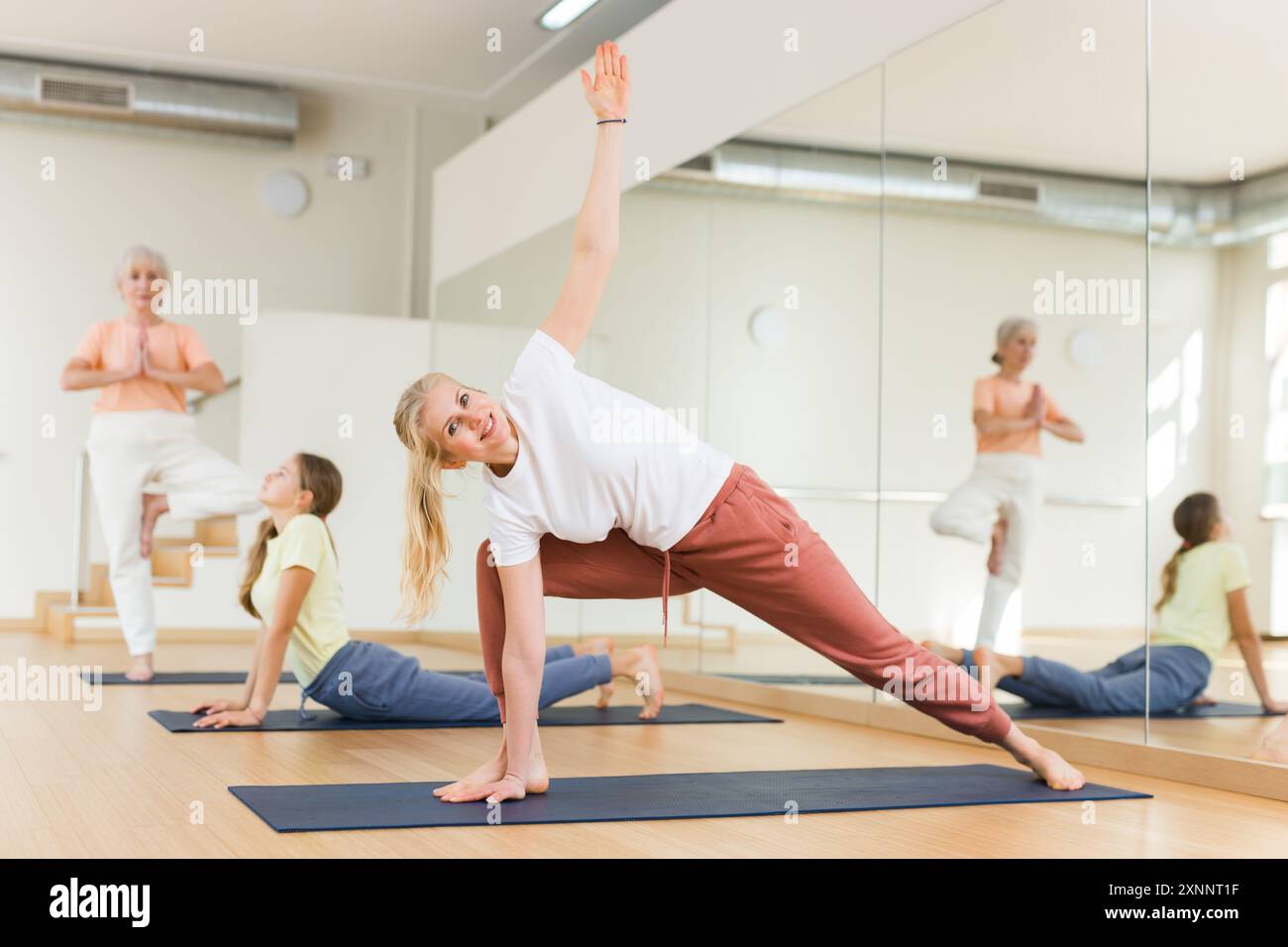 Woman practicing yoga family hi-res stock photography and images - Alamy