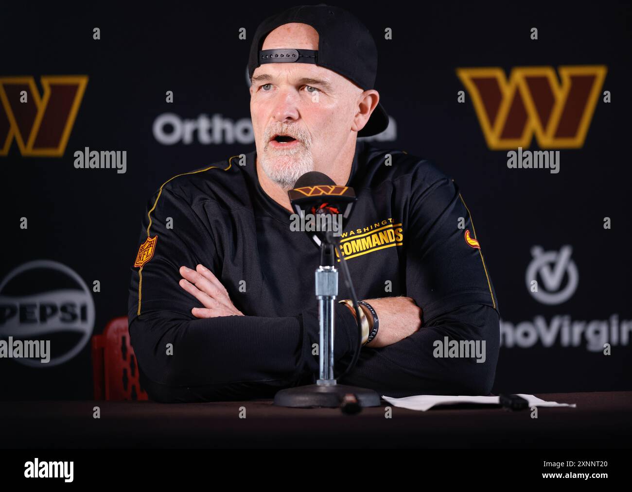 Washington Commanders head coach Dan Quinn addressing the media before ...
