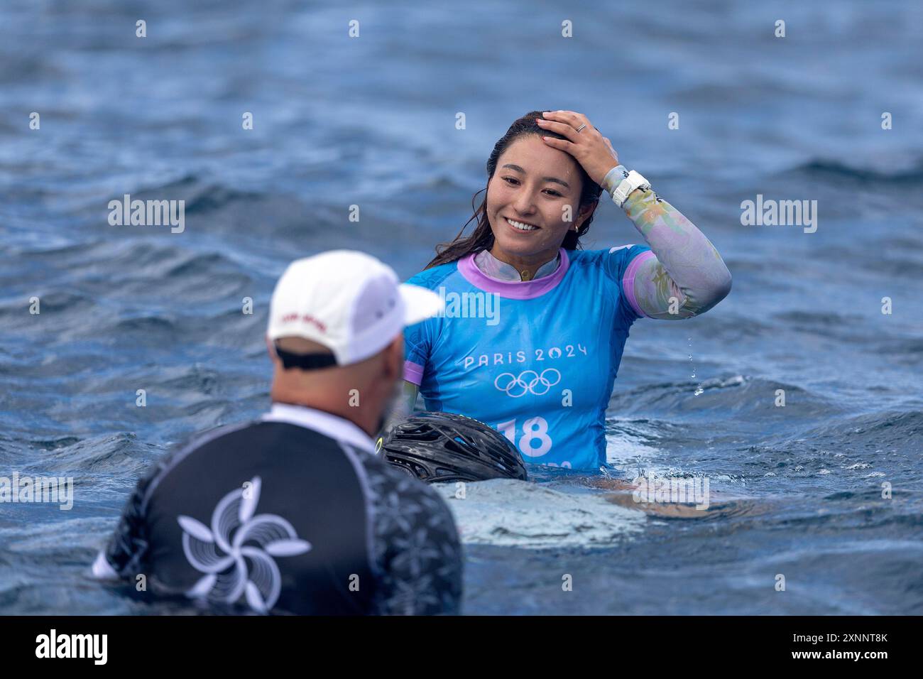 Shino Matsuda of Team Japan talks with her coach during the third round ...