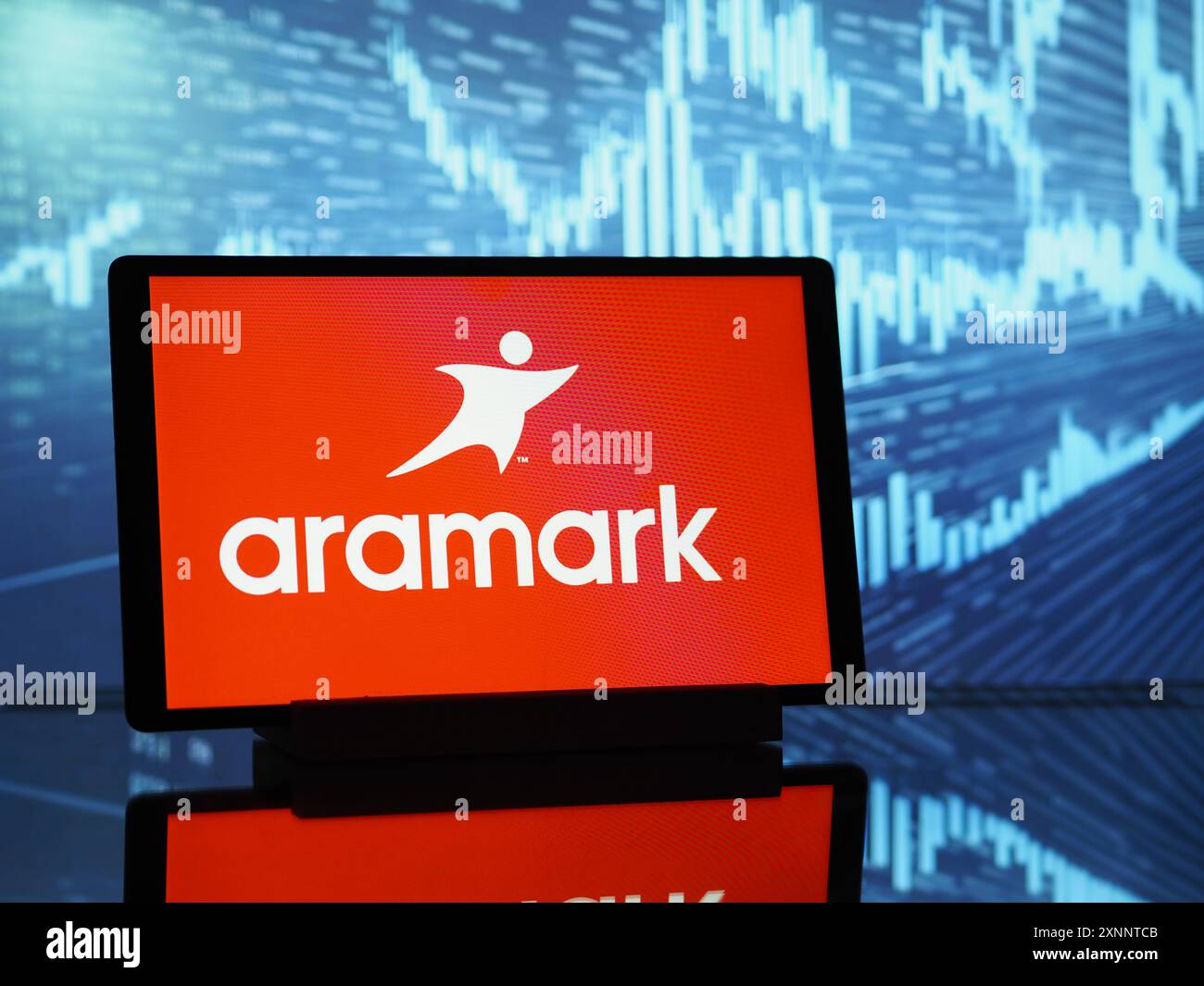 In this photo illustration, an Aramark logo seen displayed on a tablet ...