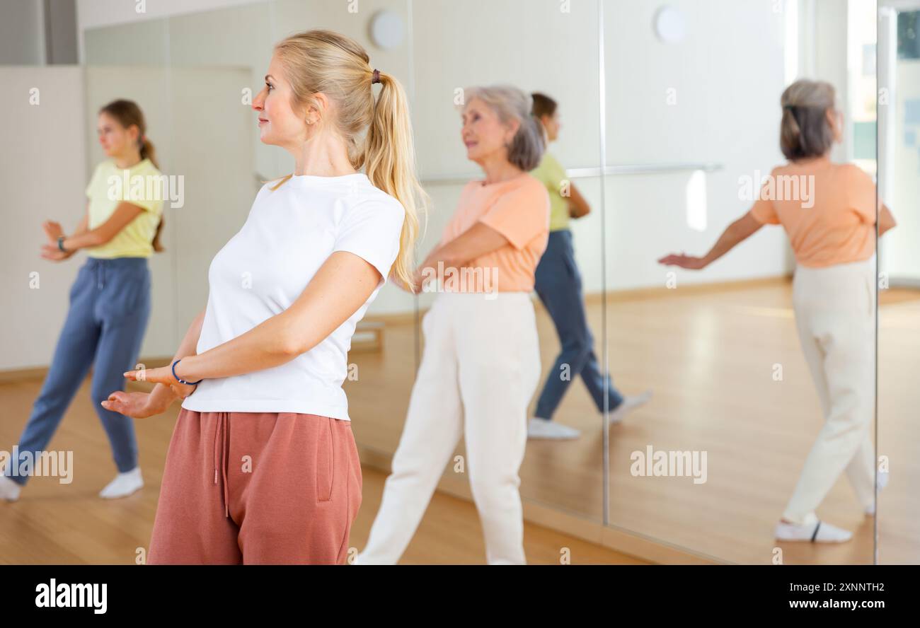 Female doing dance workout during group classe in fitness center Stock ...