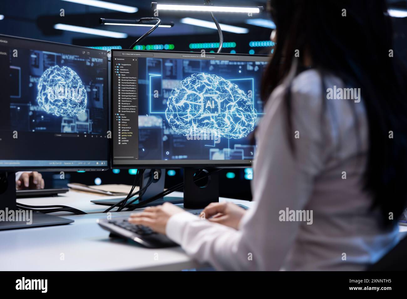 Programmer using AI tech on computer to do maintenance in server room providing storage. Worker ...