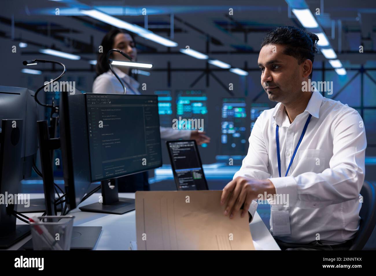 Data center professional developing emergency procedures to ensure ...