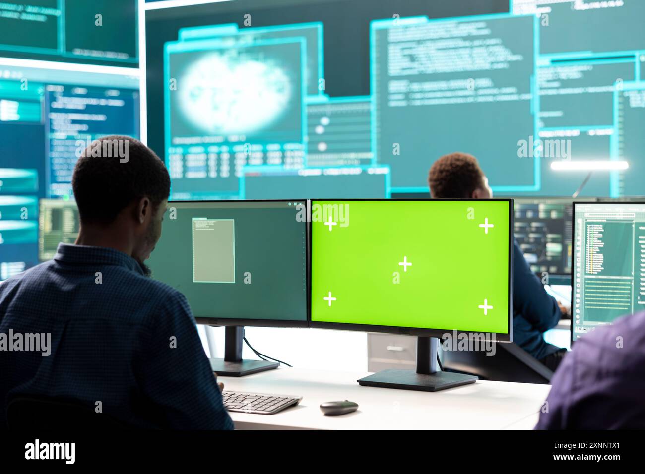 Governmental Hackers Working On Computer With Green Screen To Protect Data And Network Security