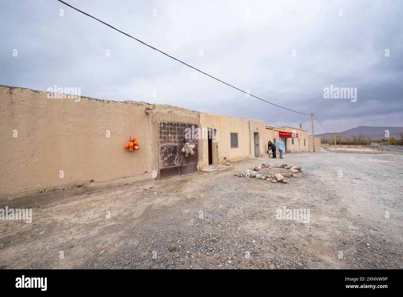 Typical Moroccan construction with a warehouse and a small roadside bar ...