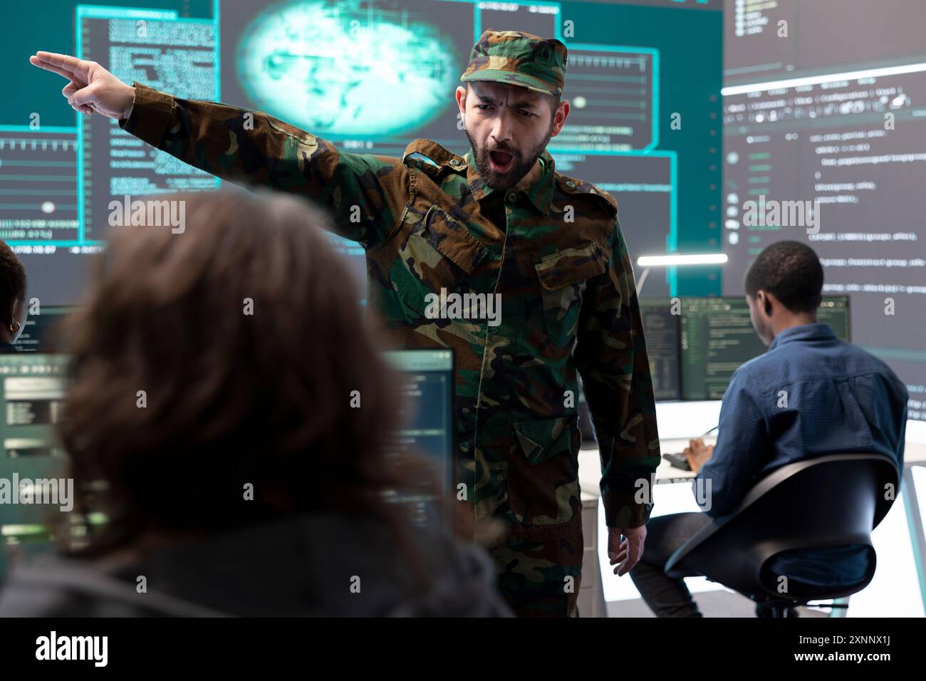 Military IT experts working on cyber security in a high tech government ...