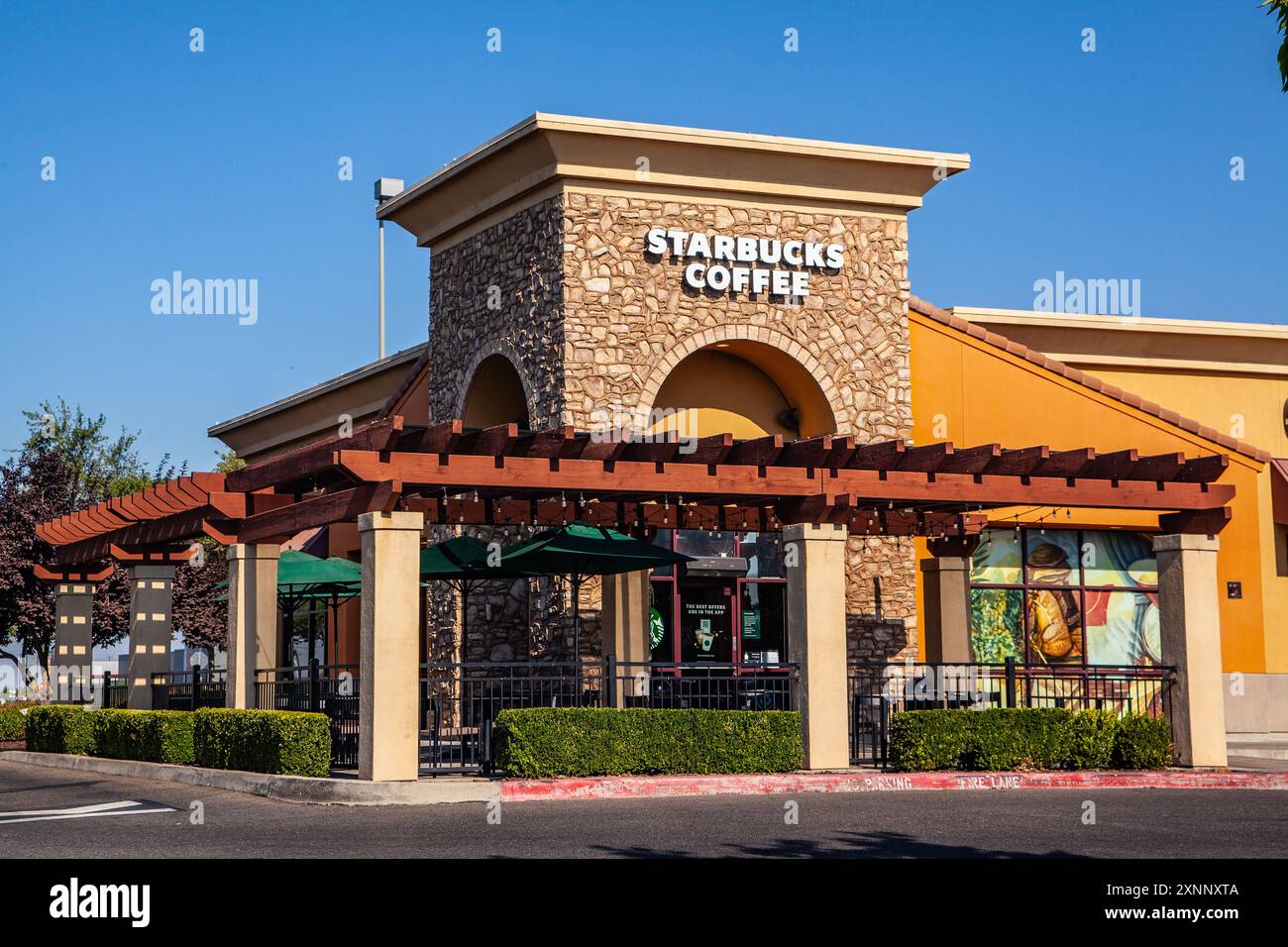 A New Starbucks store with outdoor seating in the growing Community of ...