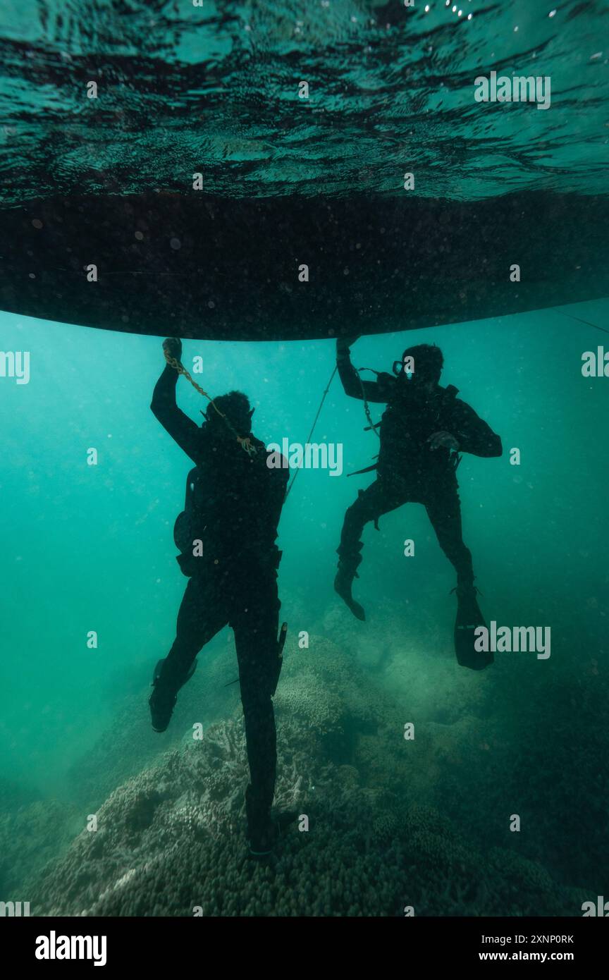Indian Marine Commando Force (MARCOS) operators navigate through the ...