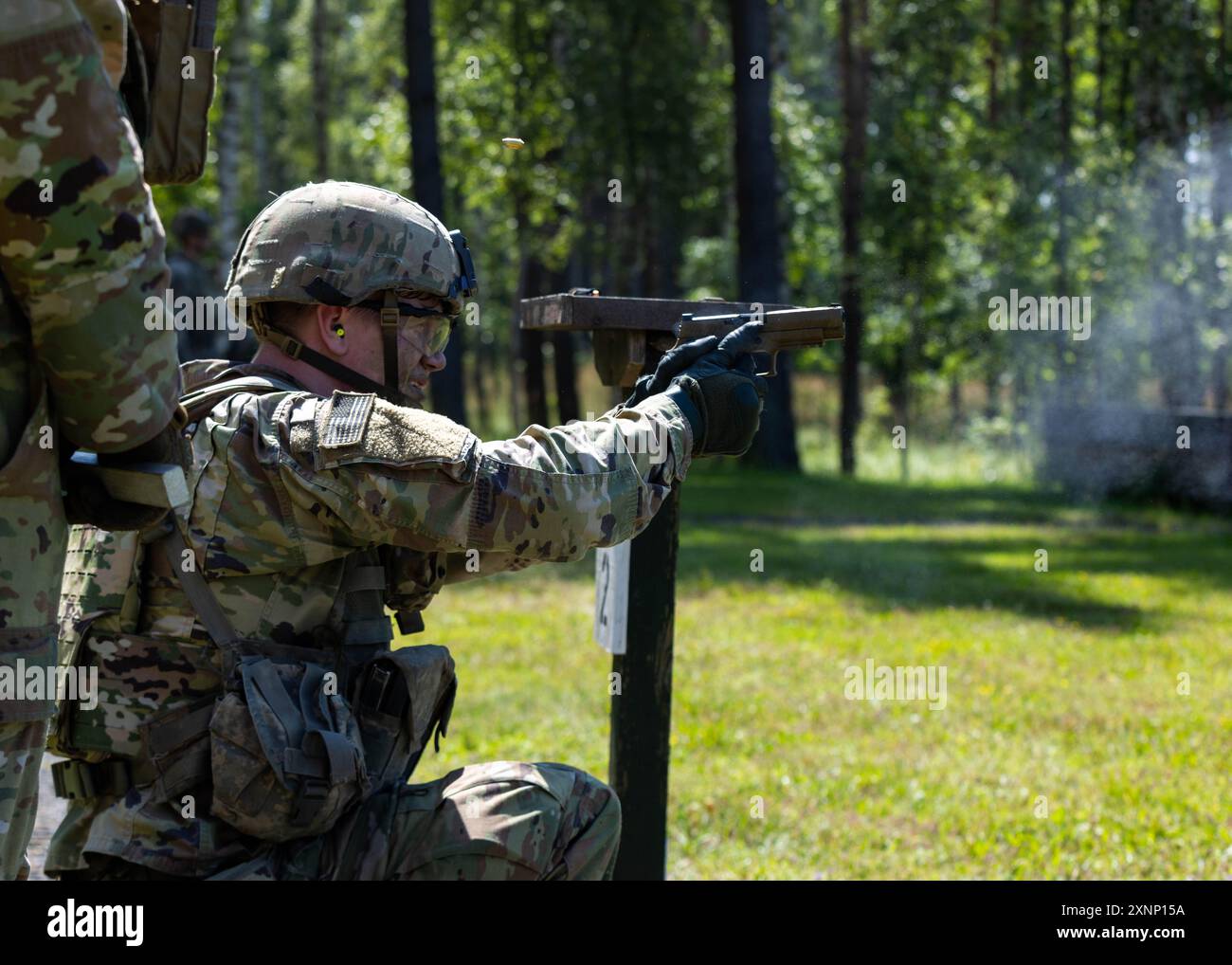 A U.S. Soldier, assigned to the 7th Army Training Command, fires an M17 ...