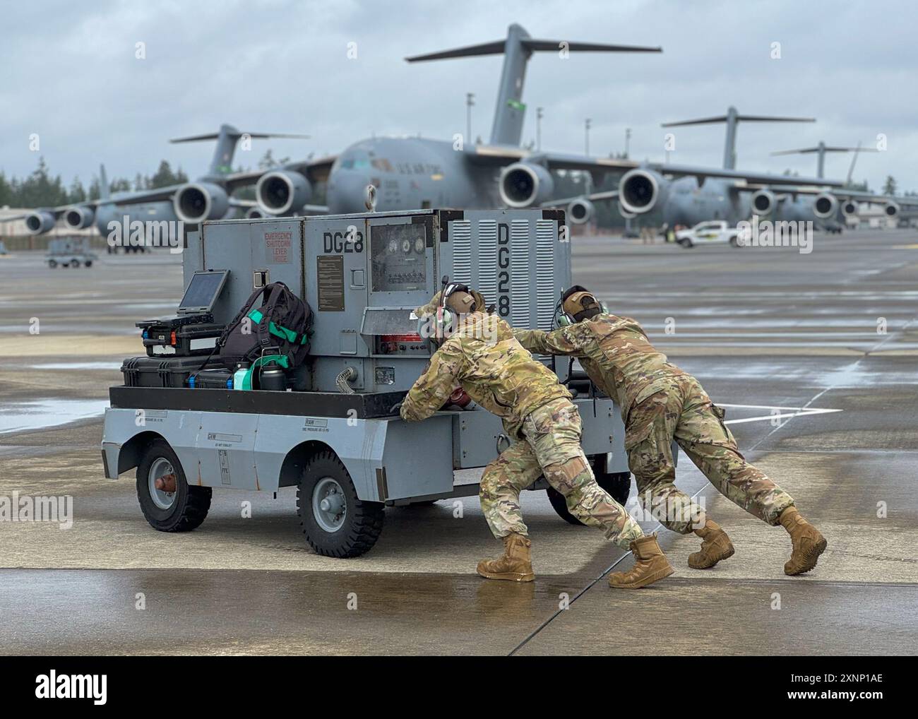 U.S. Air Force Senior Airman Edward Cho, left, and Airman Radu Brujban ...