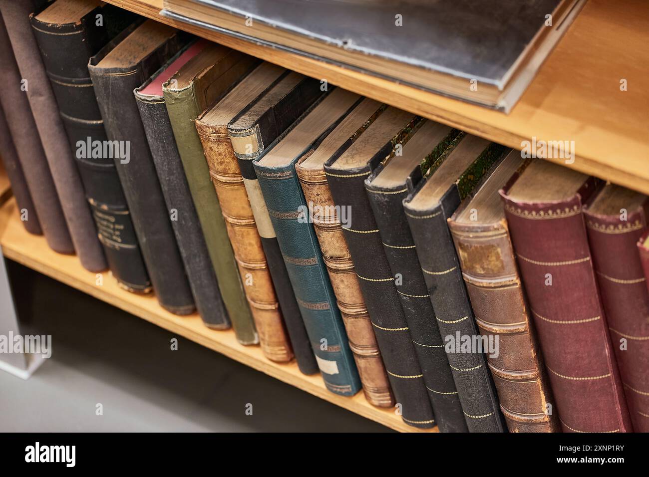 Old books in a library Stock Photo - Alamy