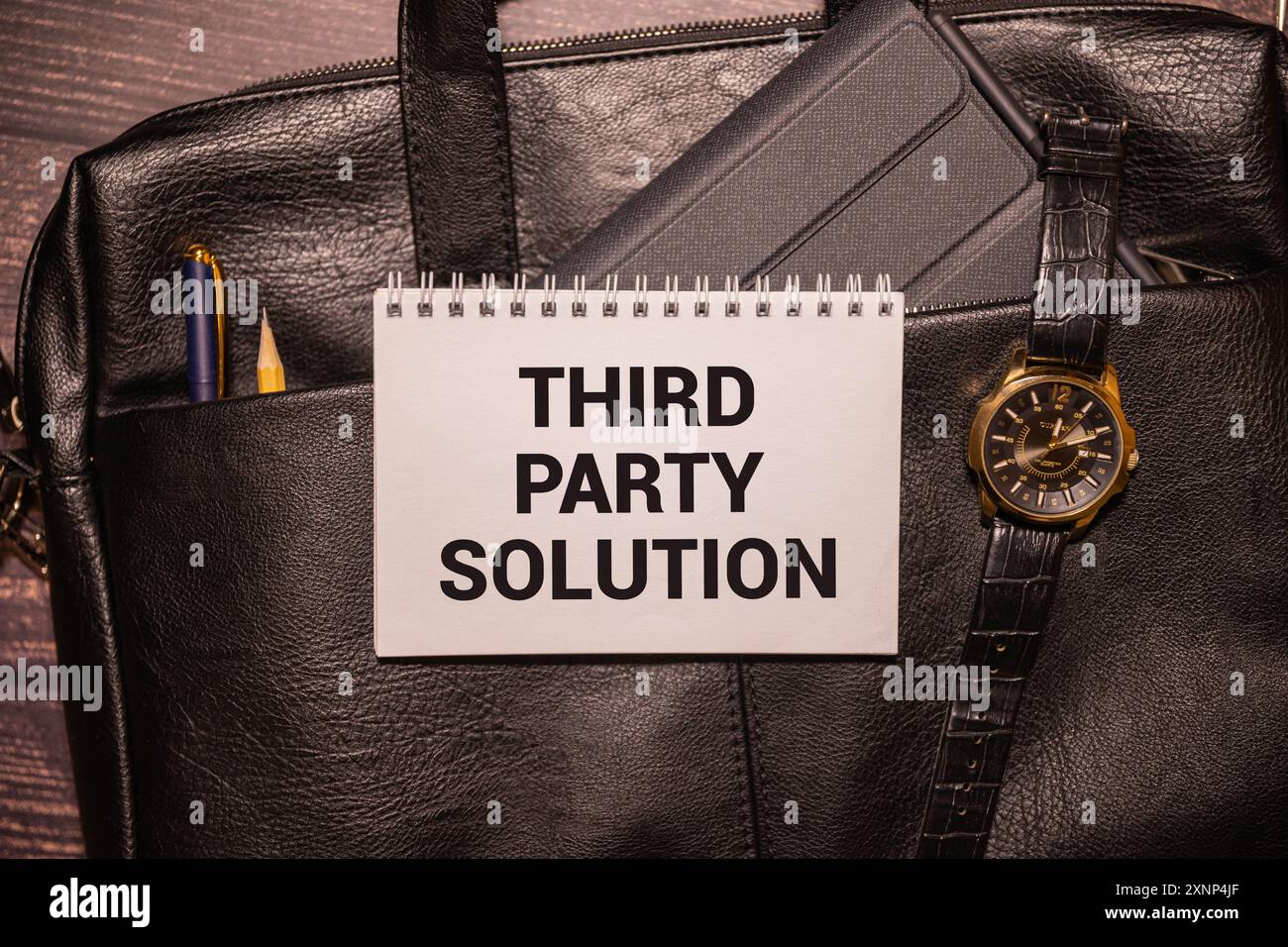 Closeup on businessman holding a card with THIRD PARTY SOLUTION message ...
