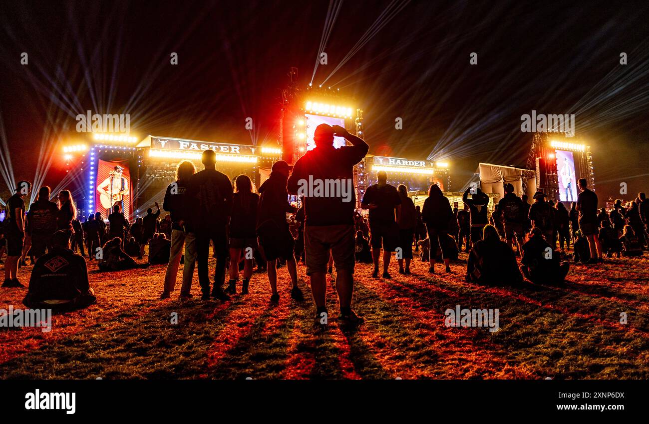 Wacken, Germany. 01st Aug, 2024. Festival-goers celebrate in front of ...