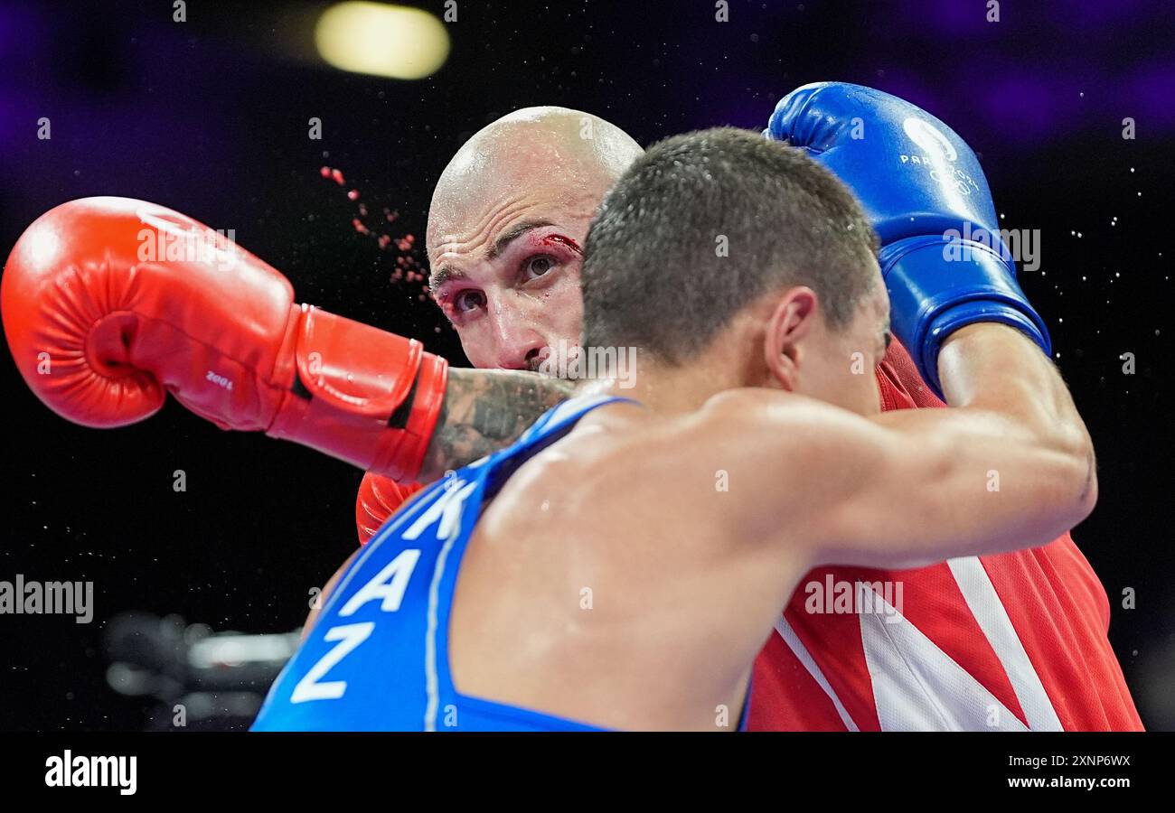 Paris, France. 1st Aug, 2024. Lasha Guruli (rear) of Georgia competes ...