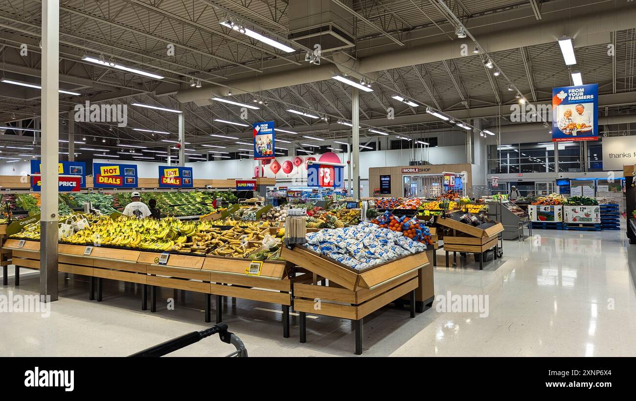Fresh vegetables and fruits on the counter in a superstore Stock Photo ...