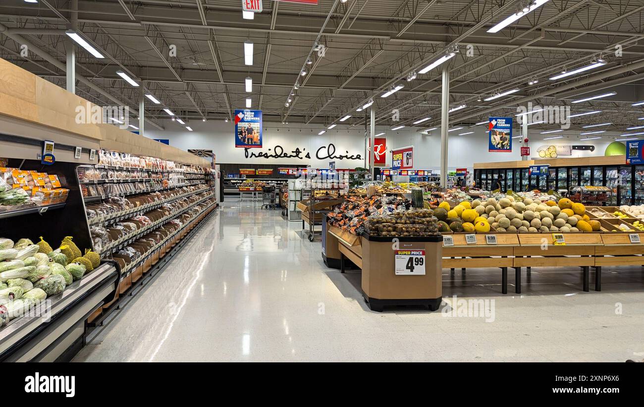 Fresh vegetables and fruits on the counter in a superstore Stock Photo ...
