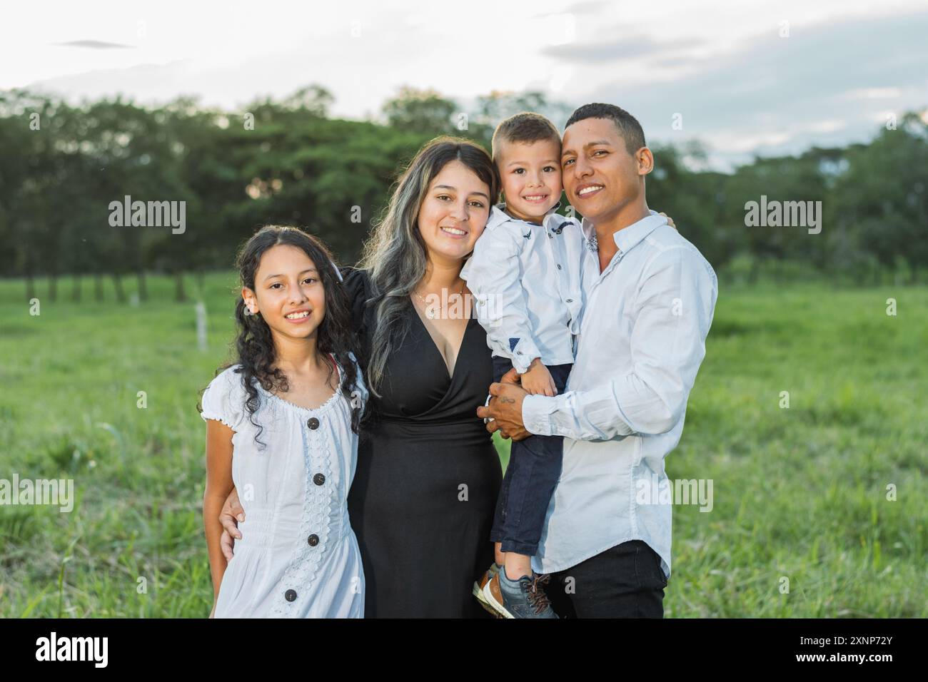 latin family, together posing happily smiling as they stroll through ...