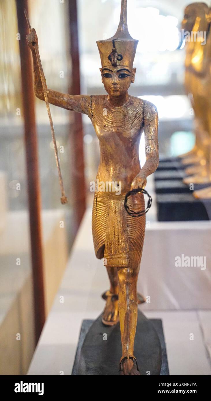 Cairo,Egypt,December 31,2019-Gilded statue of Tutankhamun with a spear ...