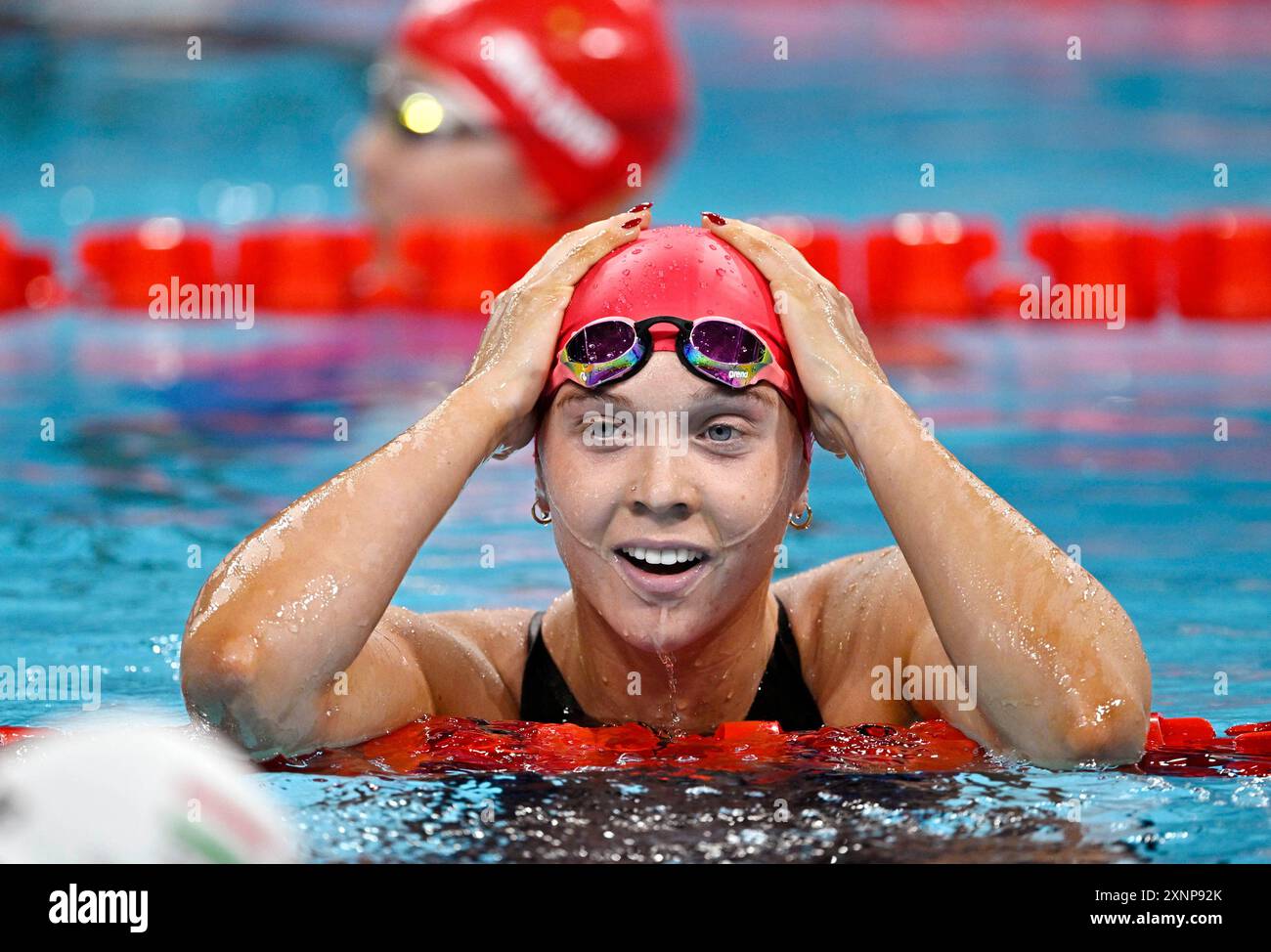 Paris, France. 1st Aug, 2024. Honey Osrin of Britain reacts after the women's 200m backstroke ...