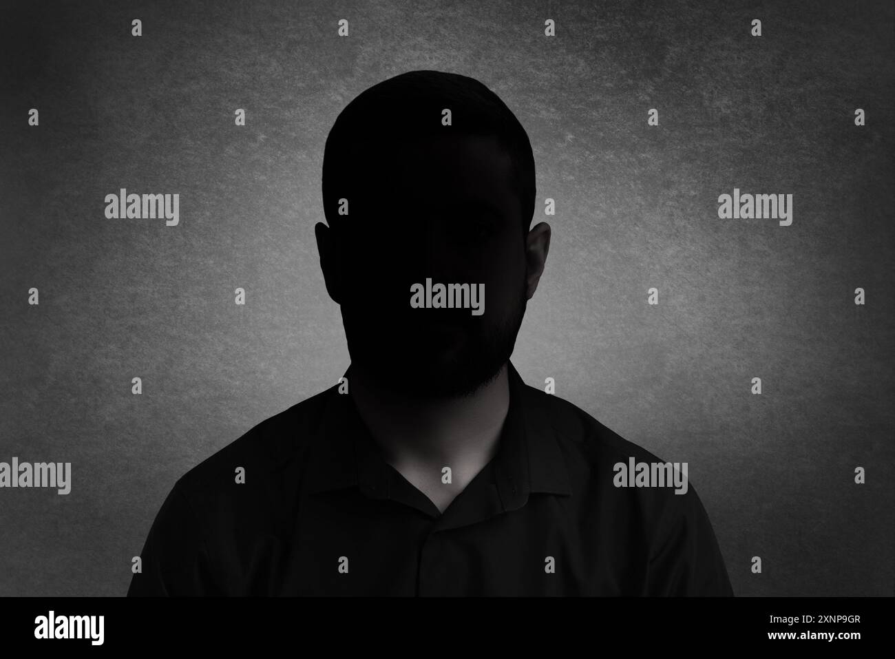 Anonymous person. Shaded portrait of man on grey gradient background ...