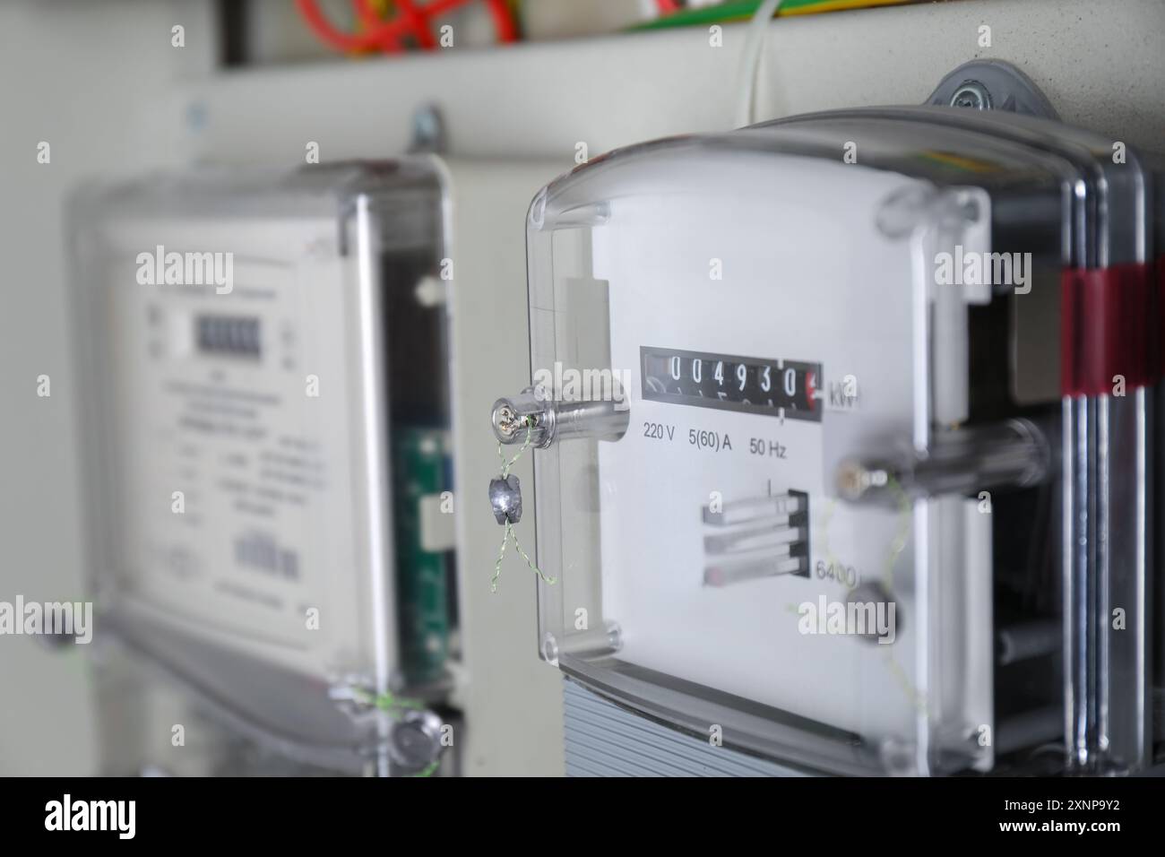 Electric meters in fuse box, closeup view. Energy measuring device ...