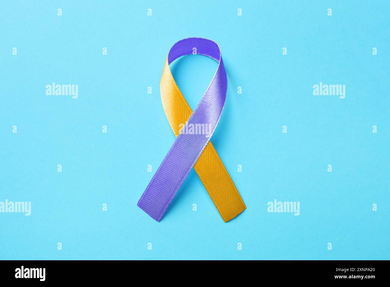 World Psoriasis Day. Orange and orchid awareness ribbon as symbol of ...
