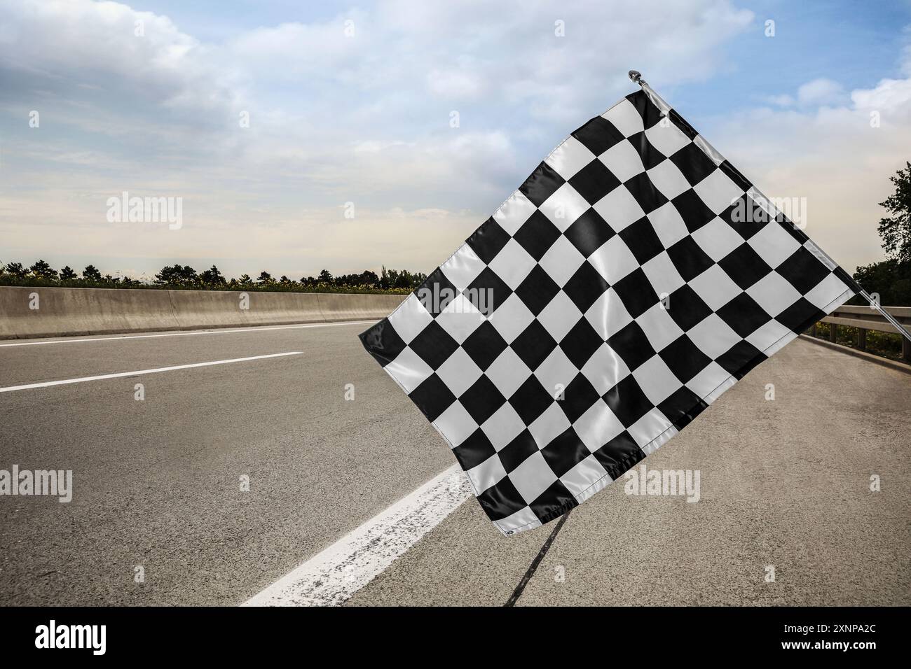 Checkered finish flag and asphalt racing track outdoors Stock Photo - Alamy