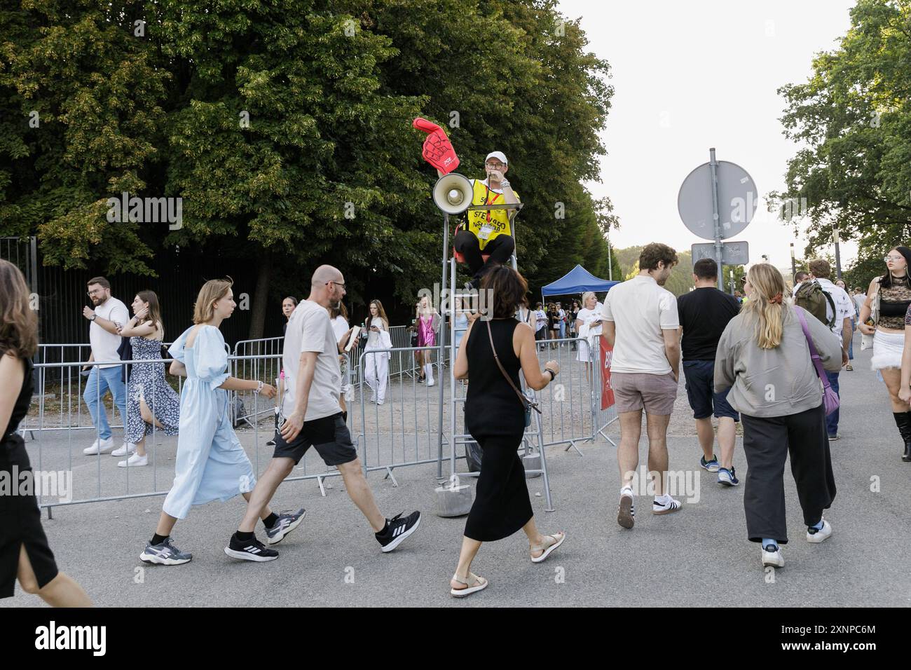 Warsaw, Poland. 01st Aug, 2024. A man on a platform seen directing fans ...