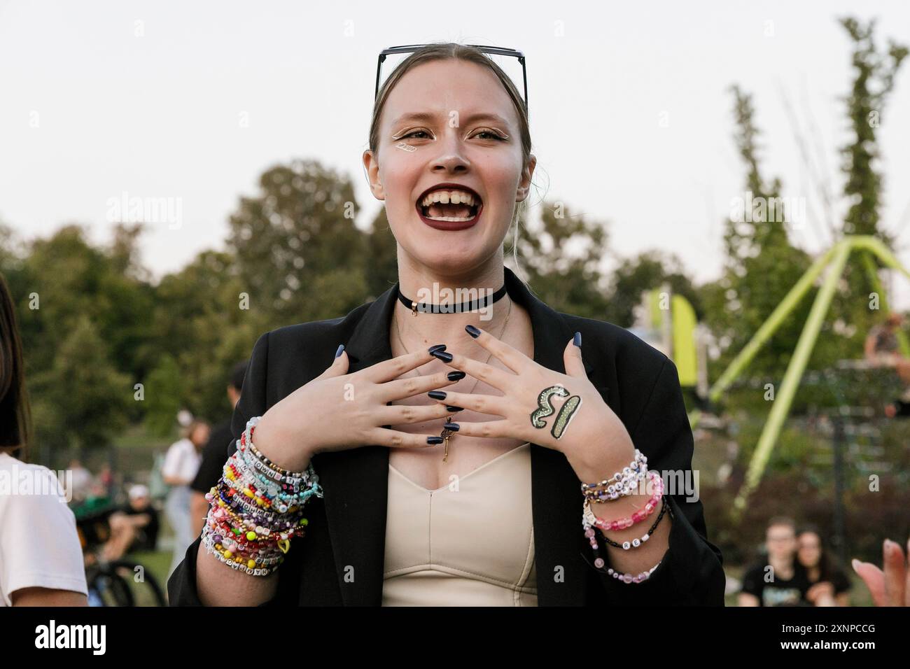A Taylor Swift fan is seen singing and dancing outside the National ...
