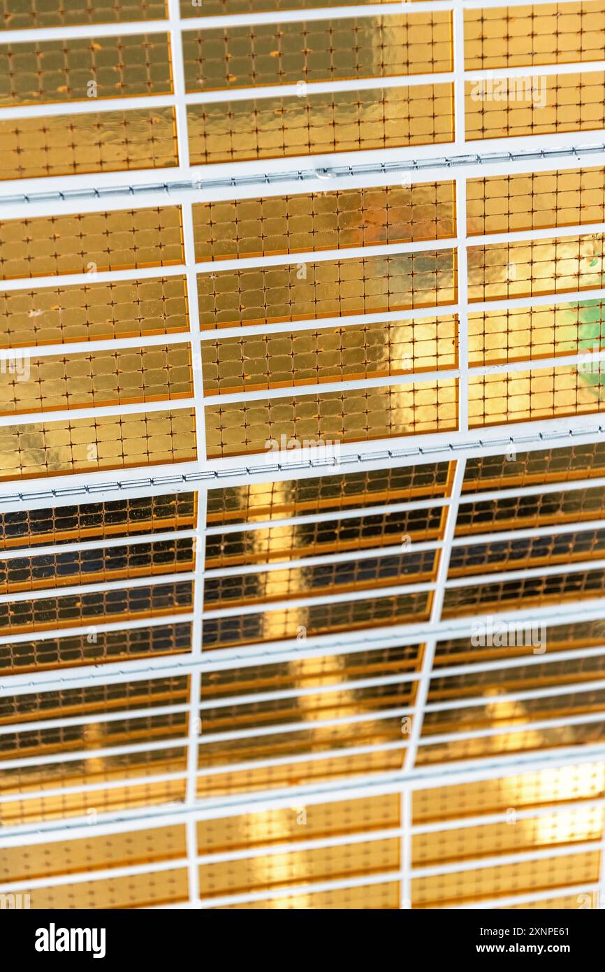 Golden shiny satellite solar panel for power generation in space. Space ...