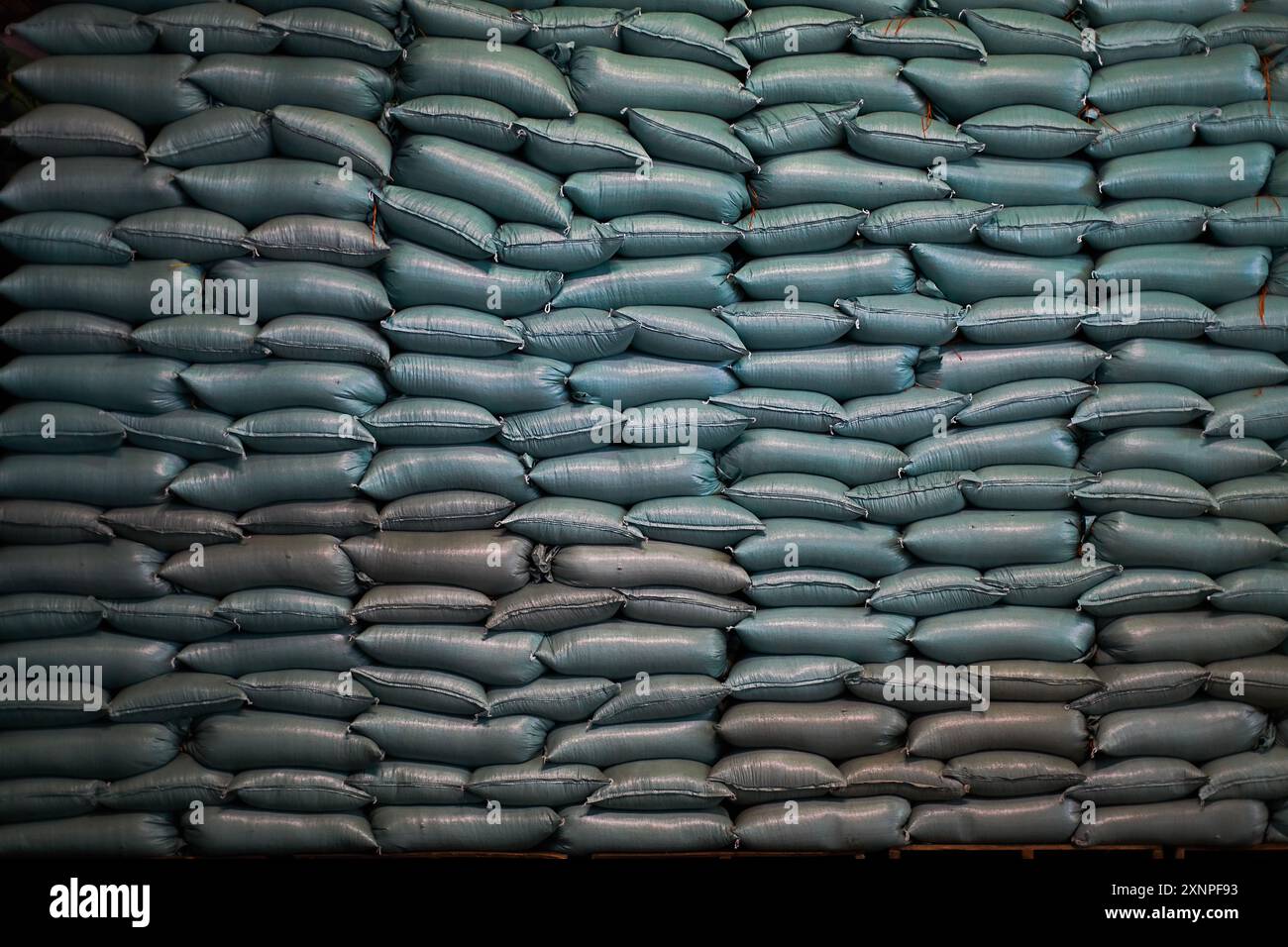 Bags of coffee beans stacked in a factory in Vietnam Stock Photo - Alamy